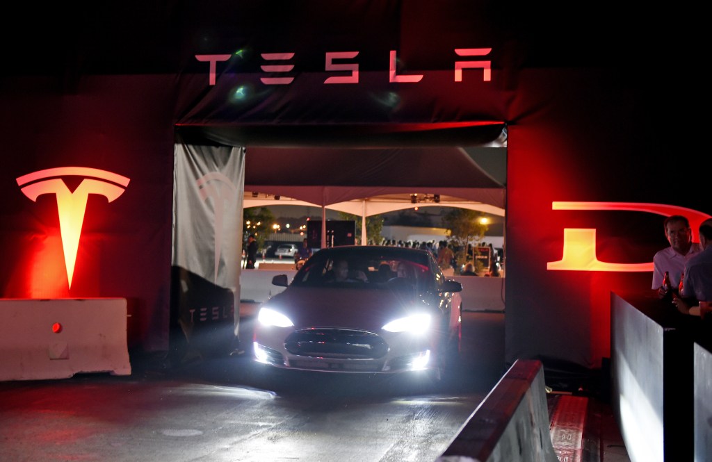 Tesla introduces all-wheel drive electric Model S with autopilot ...