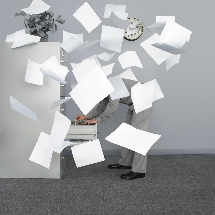 Papers Flying Off Desk