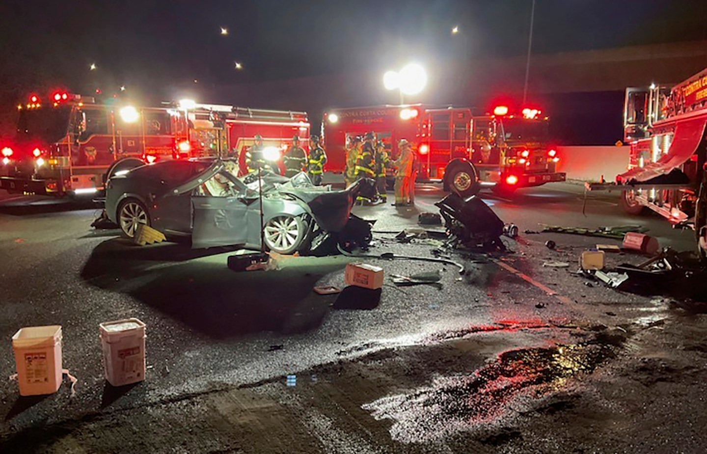 Tesla driver killed after car plows into fire truck shielding crew ...