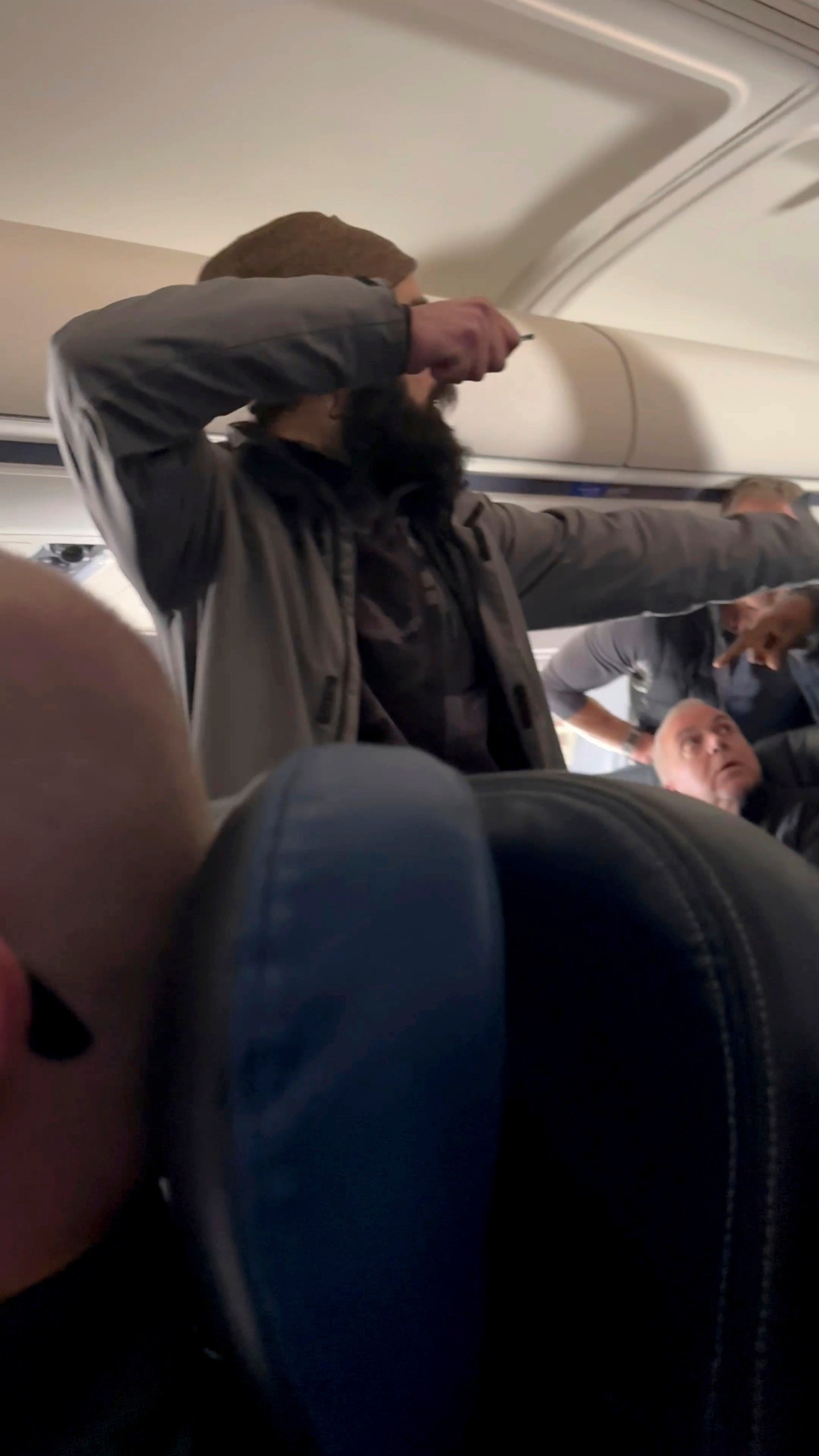 Airplane passengers restrain man who tried to stab flight attendant ...