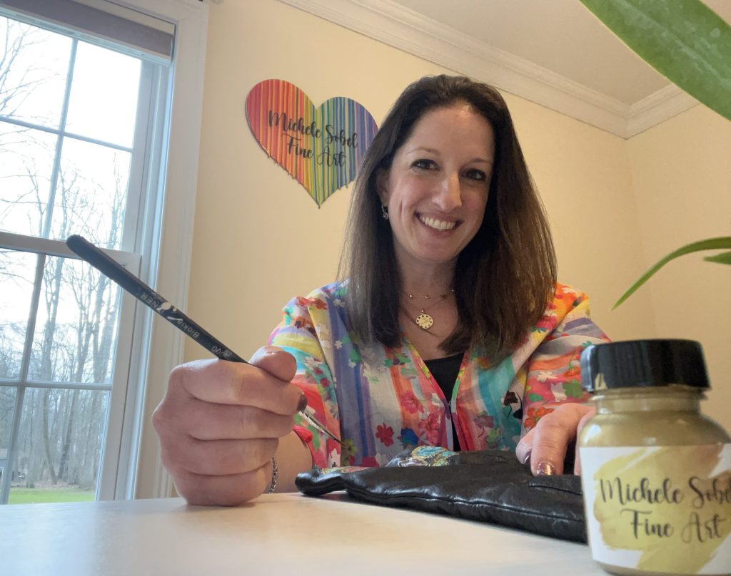 How a woman turned side hustle painting luxury handbags into a career ...